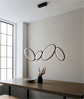 Suspended lights, larger fixtures hanging from thin wire | Lighting Styles