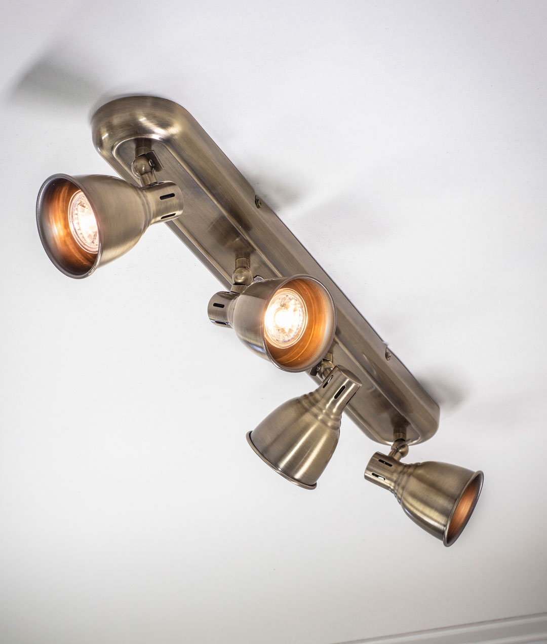 Ceiling 4 Light Adjustable Spot Bar in Antique Brass finish