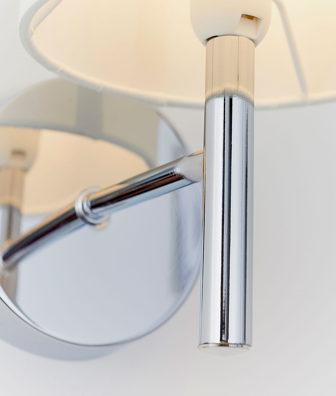 Modern Wall Light with Rounded Shade in a Brass or Chrome Finish